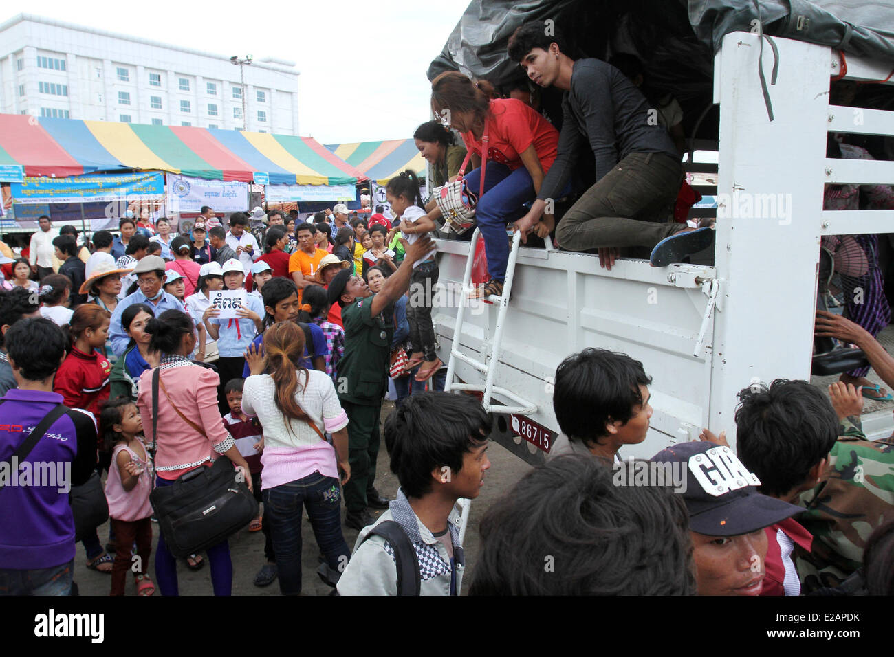 Phnom Penh, Cambodia. 18th June, 2014. Cambodian migrant workers get on ...