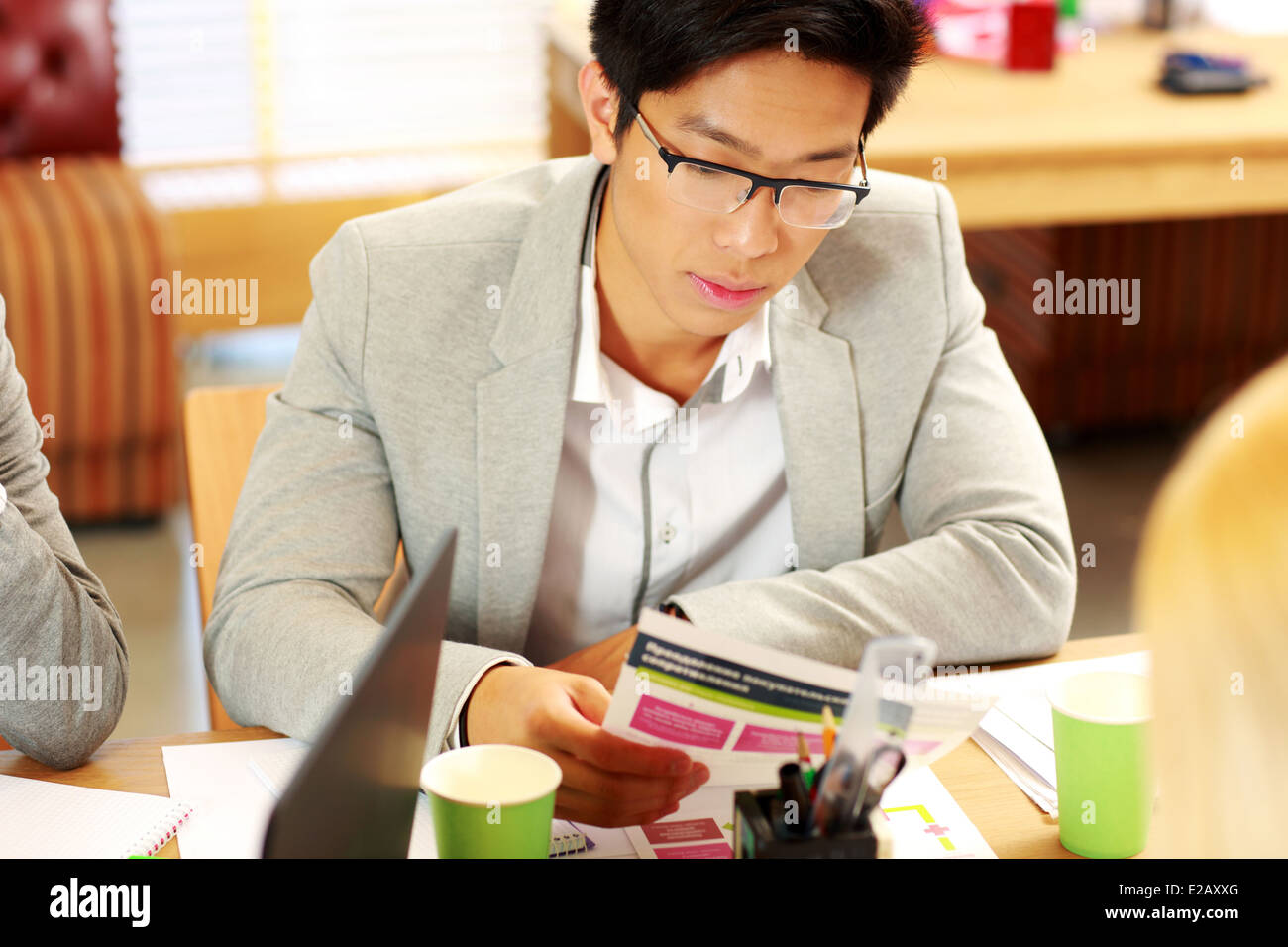 Supervisor reading sitting hi-res stock photography and images - Alamy