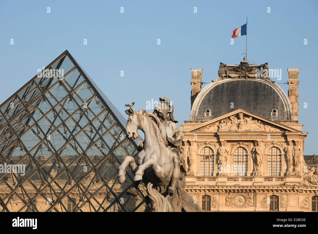 France, Paris, Louvre Museum, equidian statue in front of the Pyramid ...