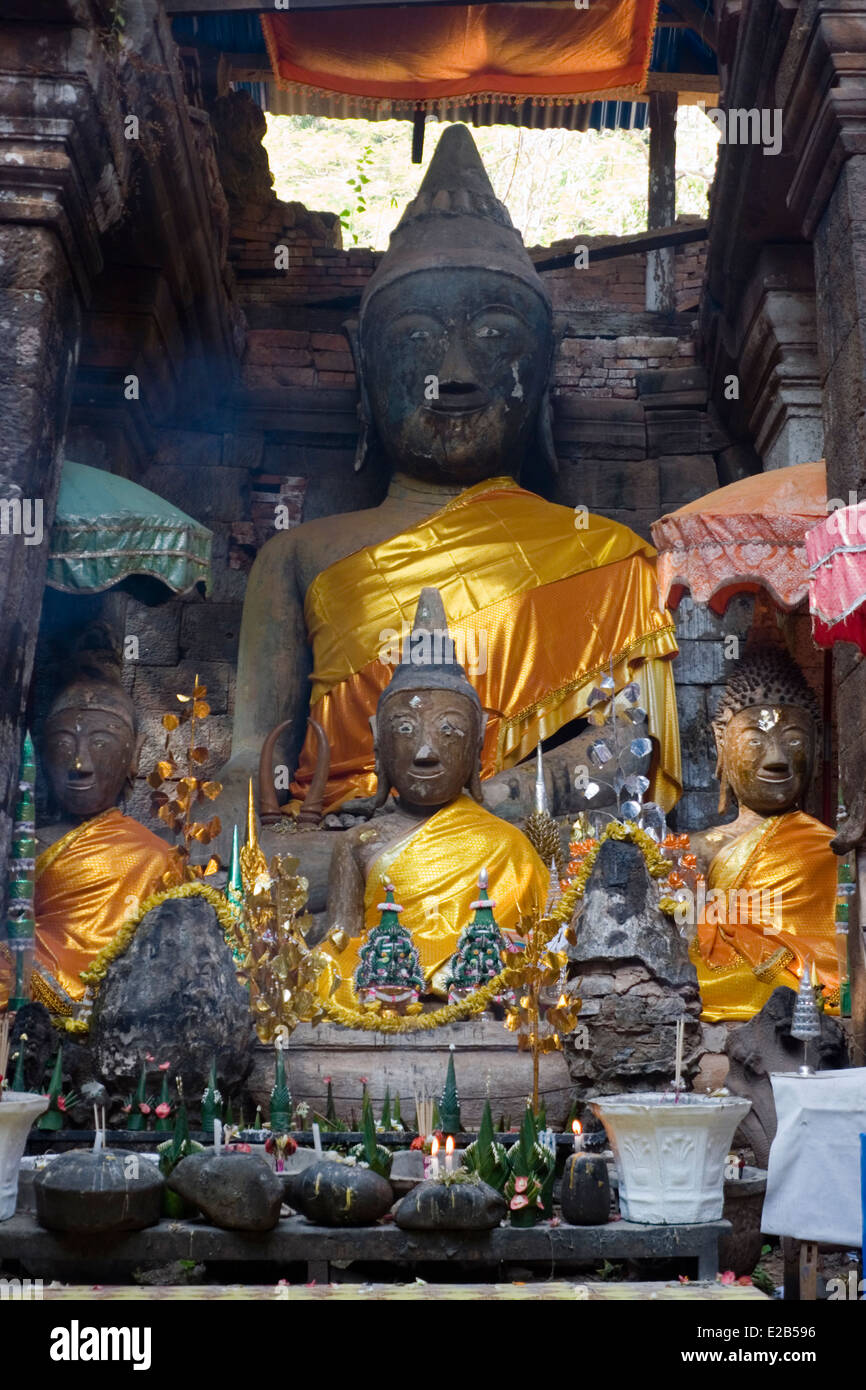 Buddhist statues grace an altar at the ruins of ancient Angkor era Wat ...