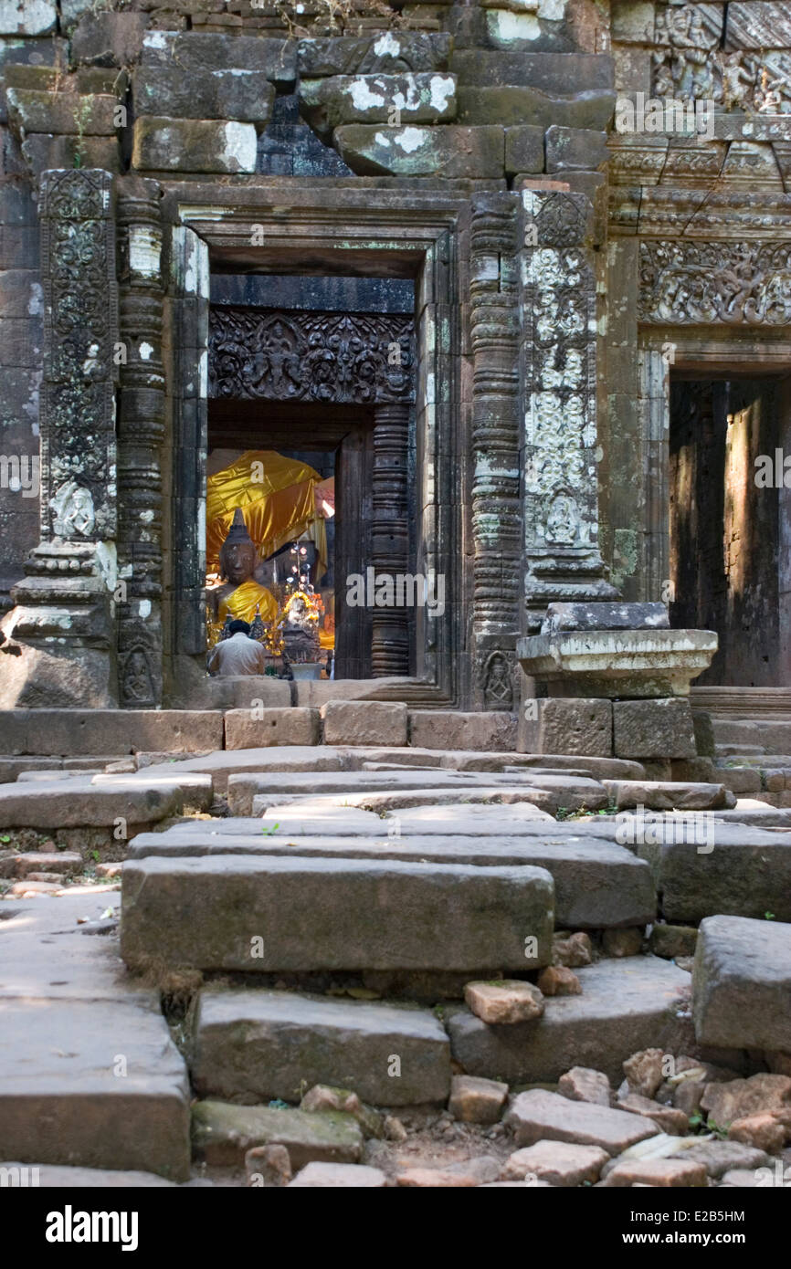 A man is worshiping at an altar at the ruins of ancient and historic ...