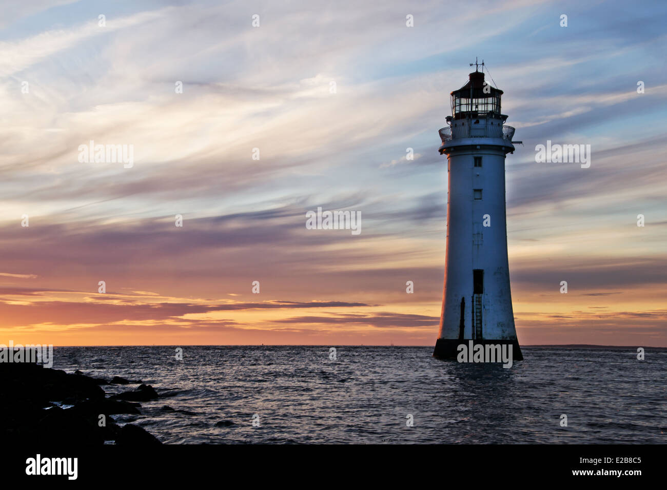 Lighthouse against sunset sky in New Brighton Stock Photo - Alamy