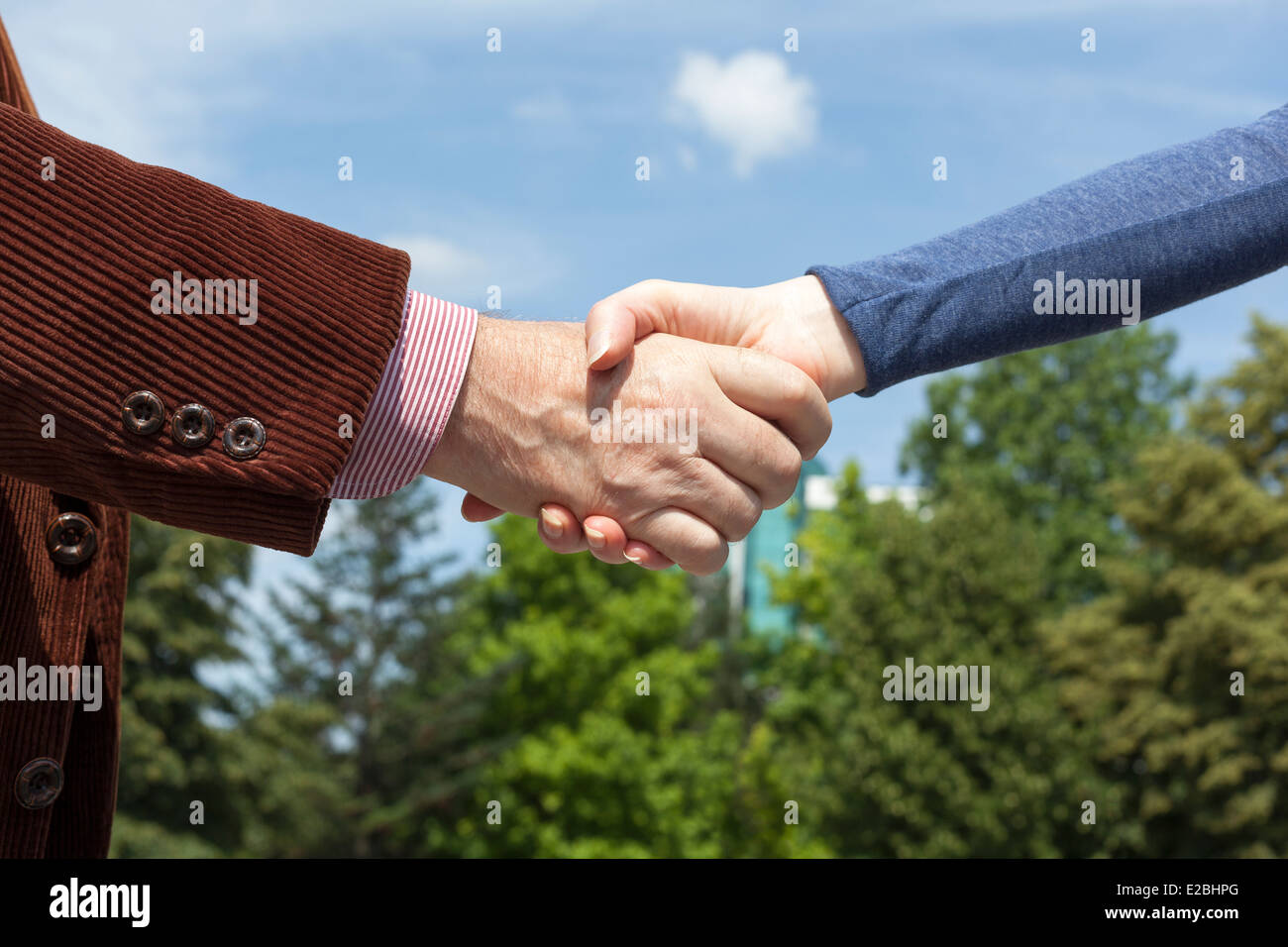 Old man and woman handshake hi-res stock photography and images - Alamy