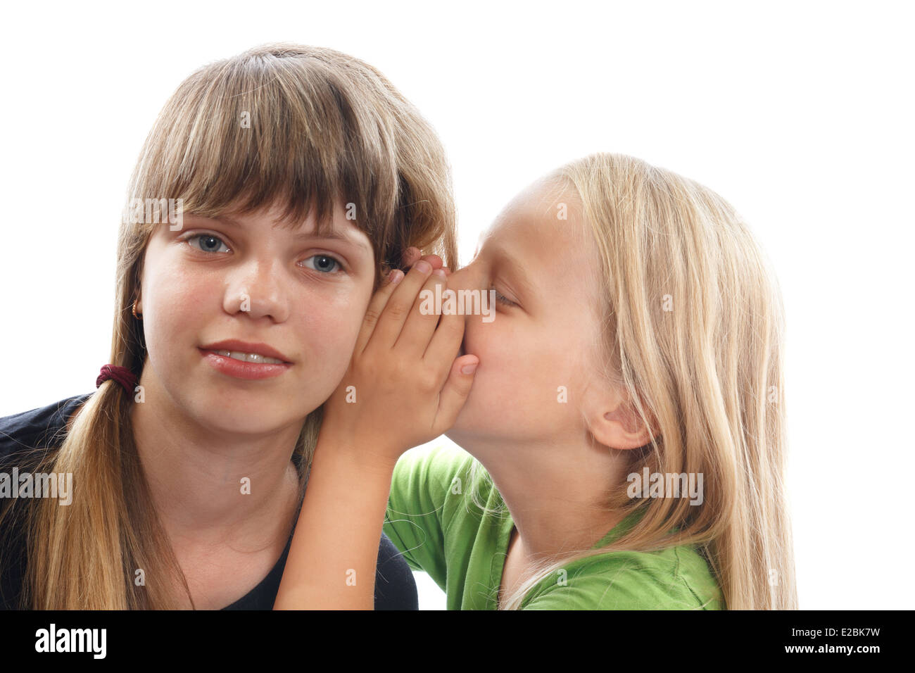 Two teenager girls whispering ear hi-res stock photography and images ...