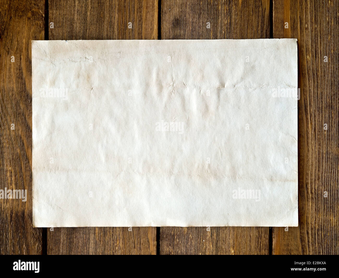 old paper on wood background Stock Photo - Alamy
