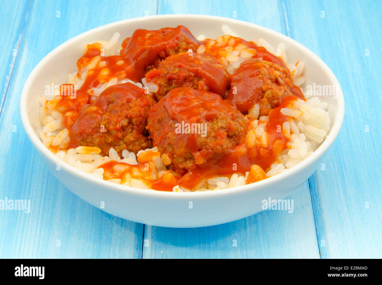 Stewed meatballs with rice and tomato sauce Stock Photo - Alamy