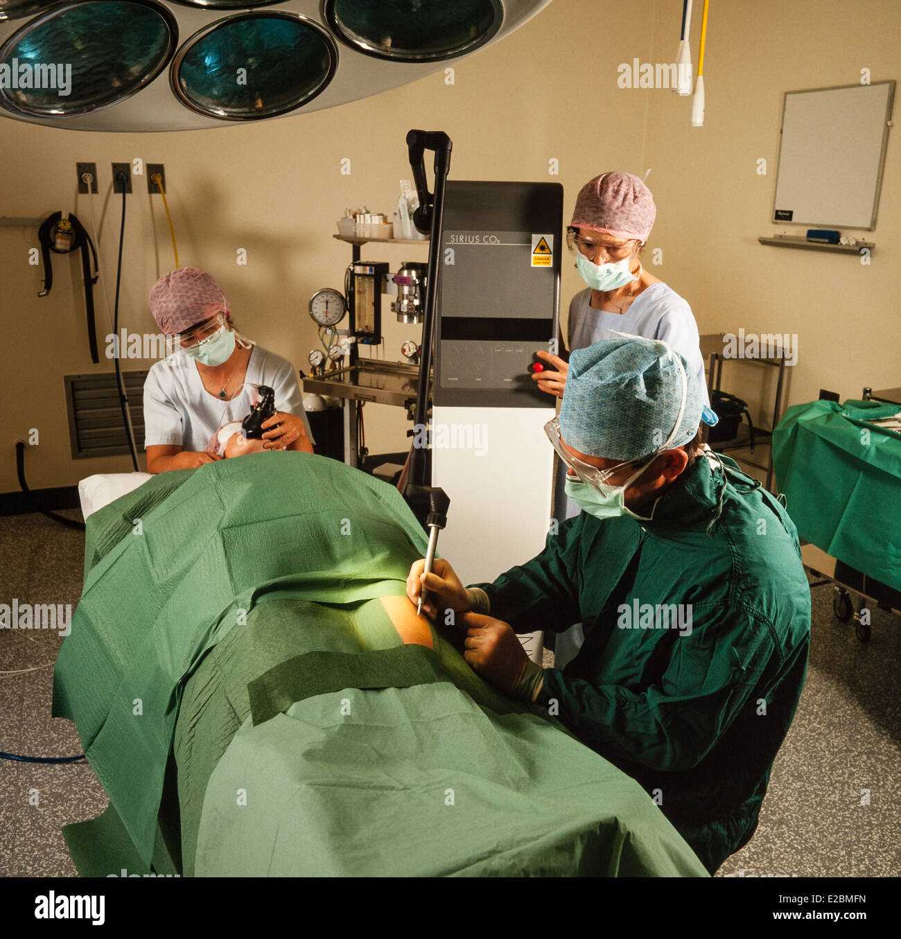 Surgeon operating with a Laser Stock Photo - Alamy