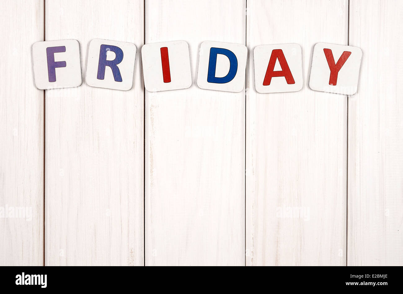 Inscription on Friday against a white wood texture Stock Photo - Alamy