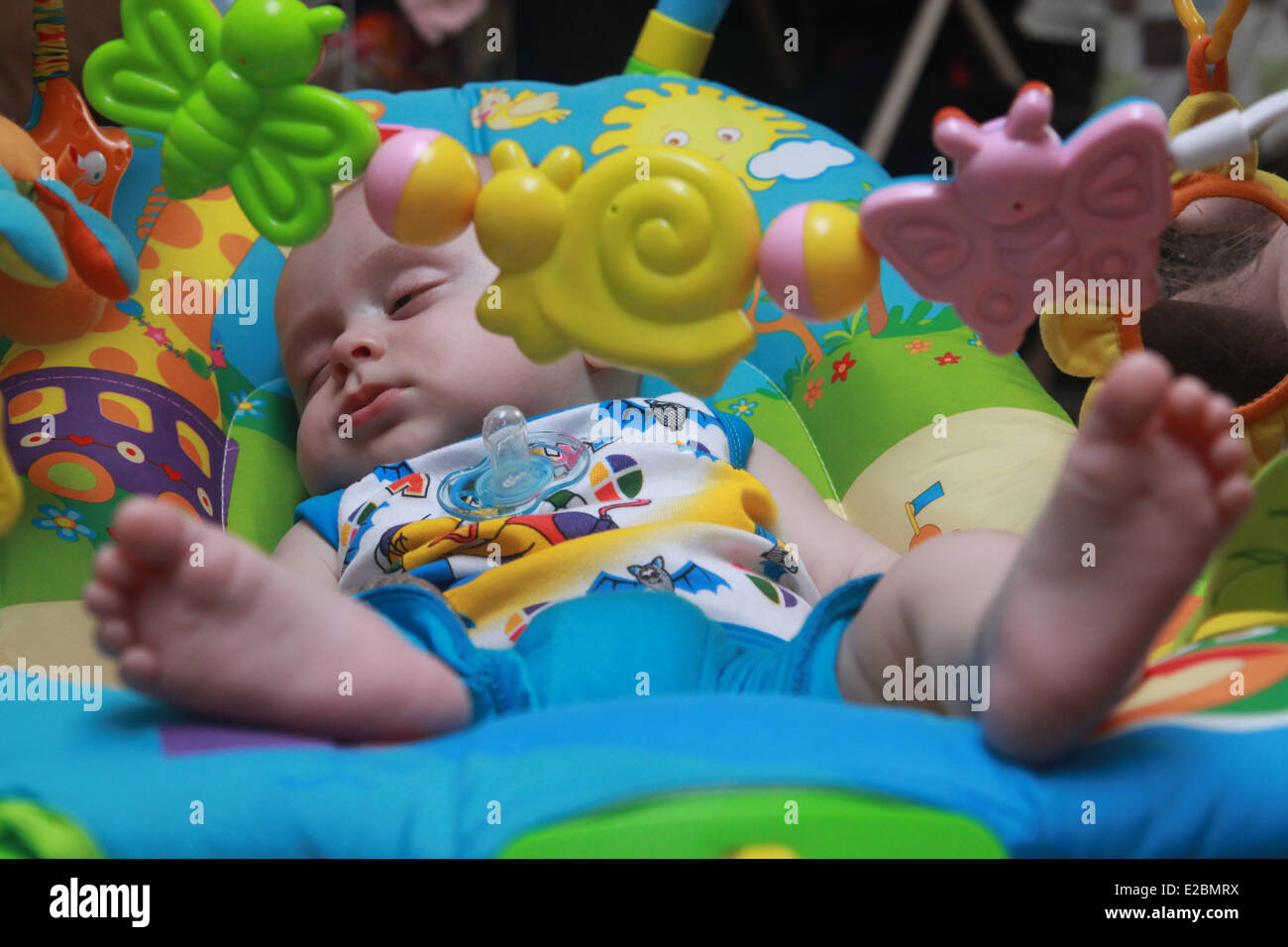 child sleeping on chair Stock Photo - Alamy
