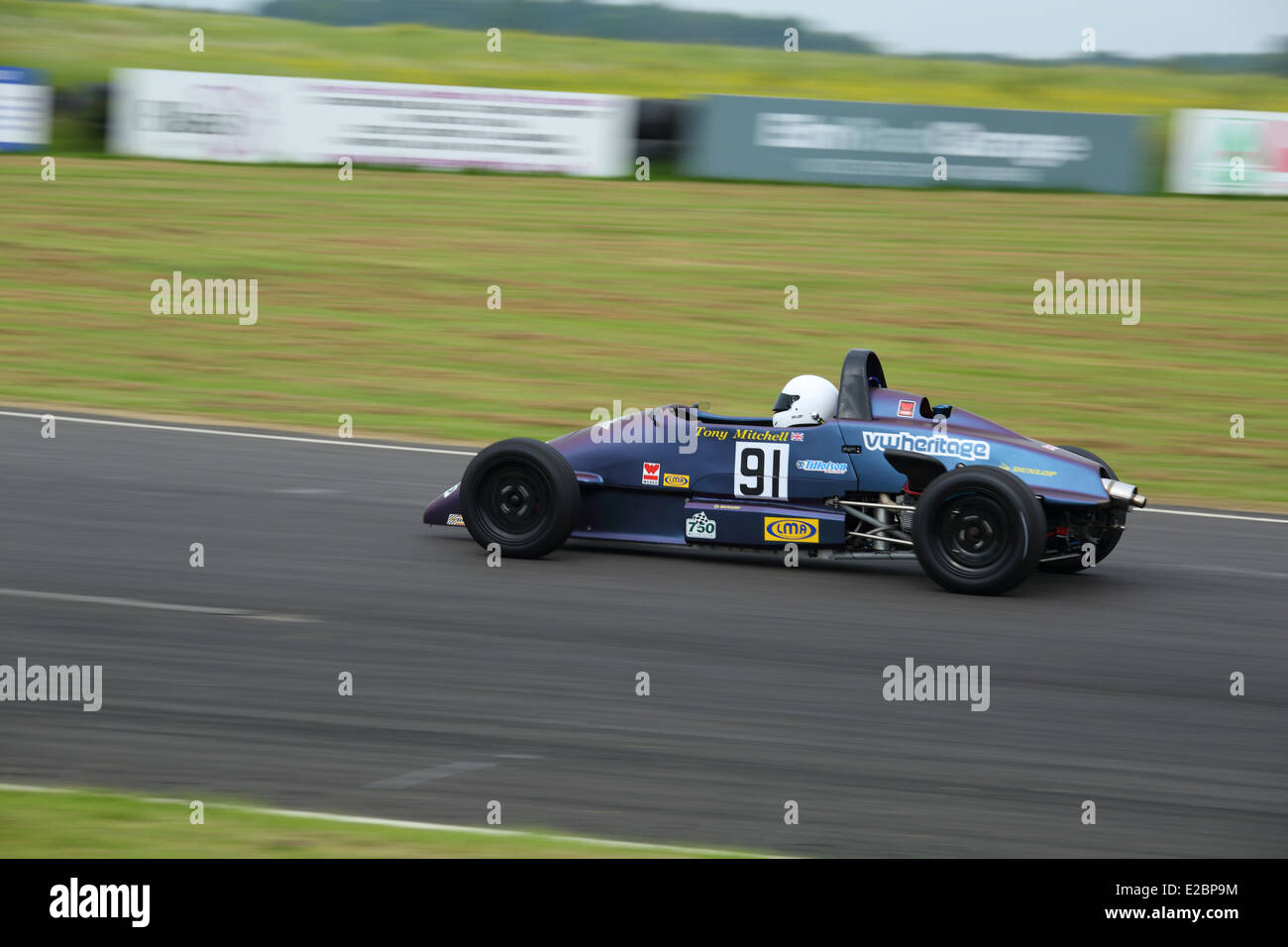 Cars racing at Castle Combe Circuit Stock Photo - Alamy