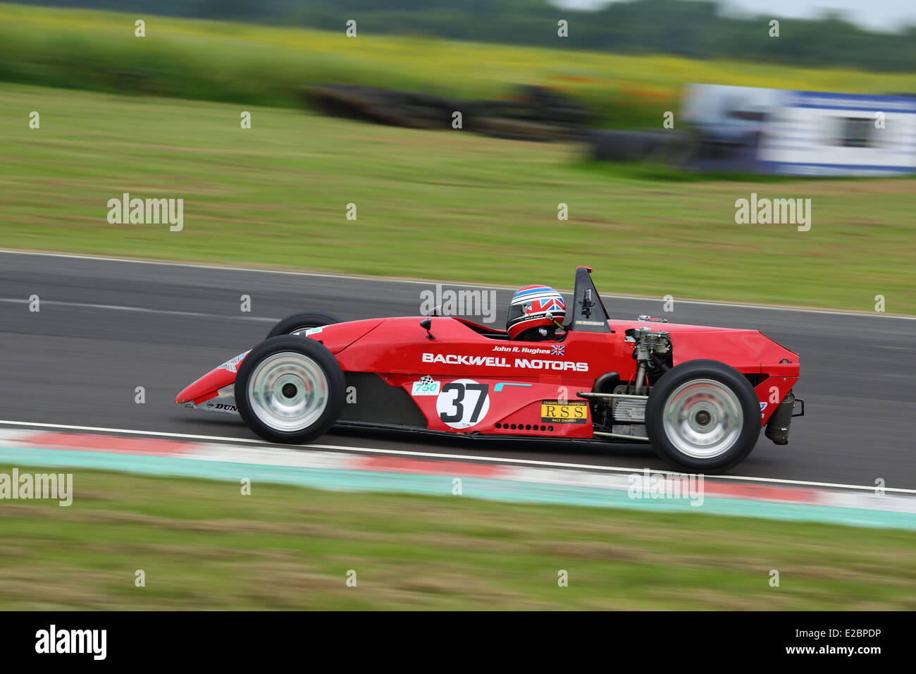 Cars racing at Castle Combe Circuit Stock Photo - Alamy