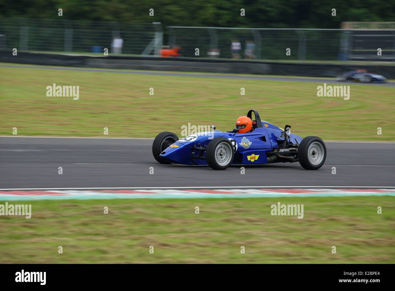 Cars racing at Castle Combe Circuit Stock Photo - Alamy