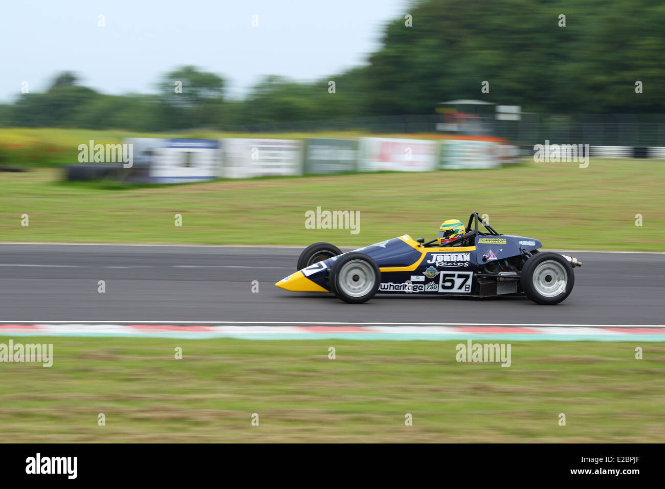 Cars racing at Castle Combe Circuit Stock Photo - Alamy