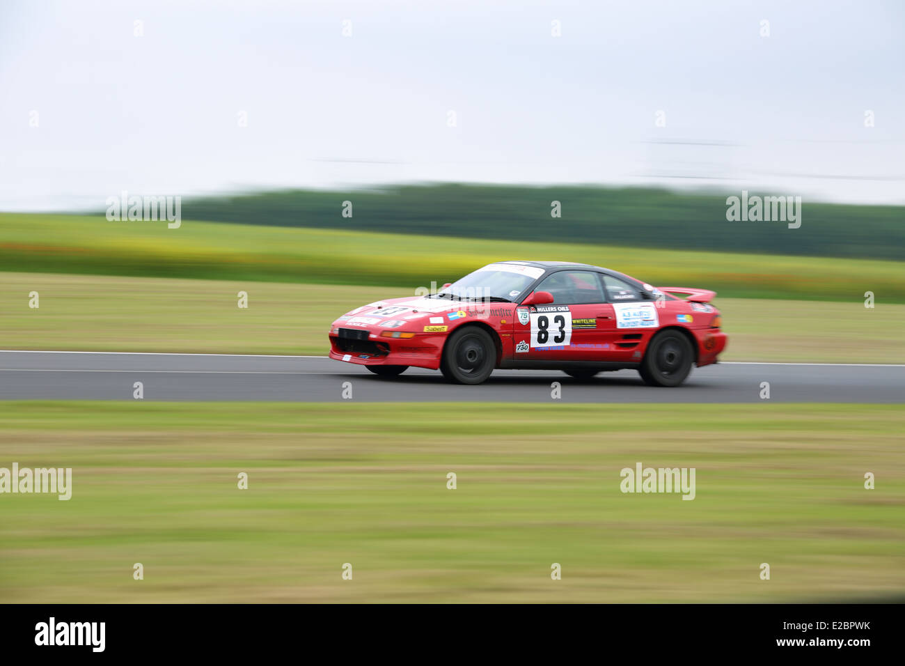 Cars racing at Castle Combe Circuit Stock Photo - Alamy
