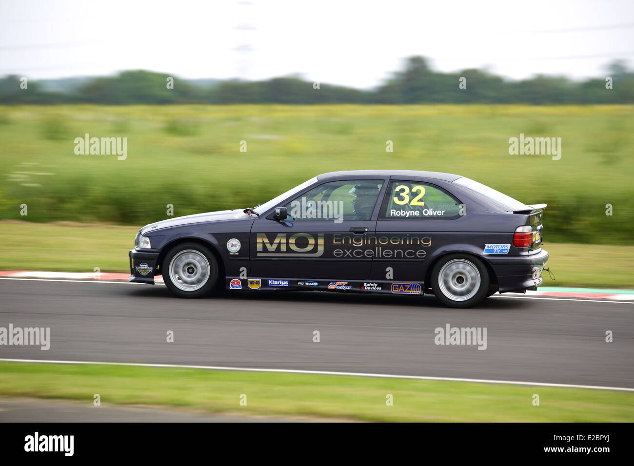 Cars racing at Castle Combe Circuit Stock Photo - Alamy