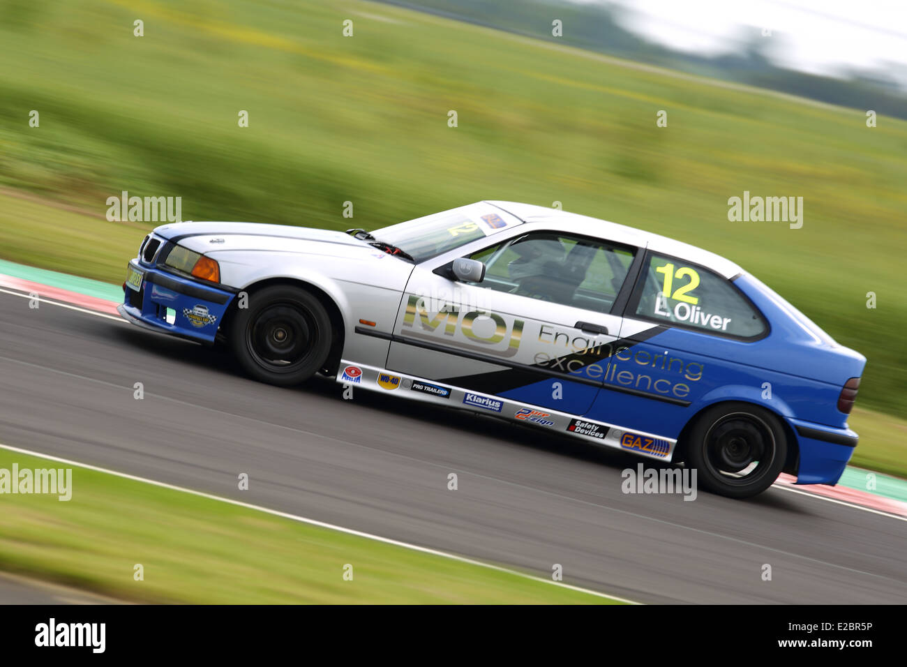 Cars racing at Castle Combe Circuit Stock Photo - Alamy