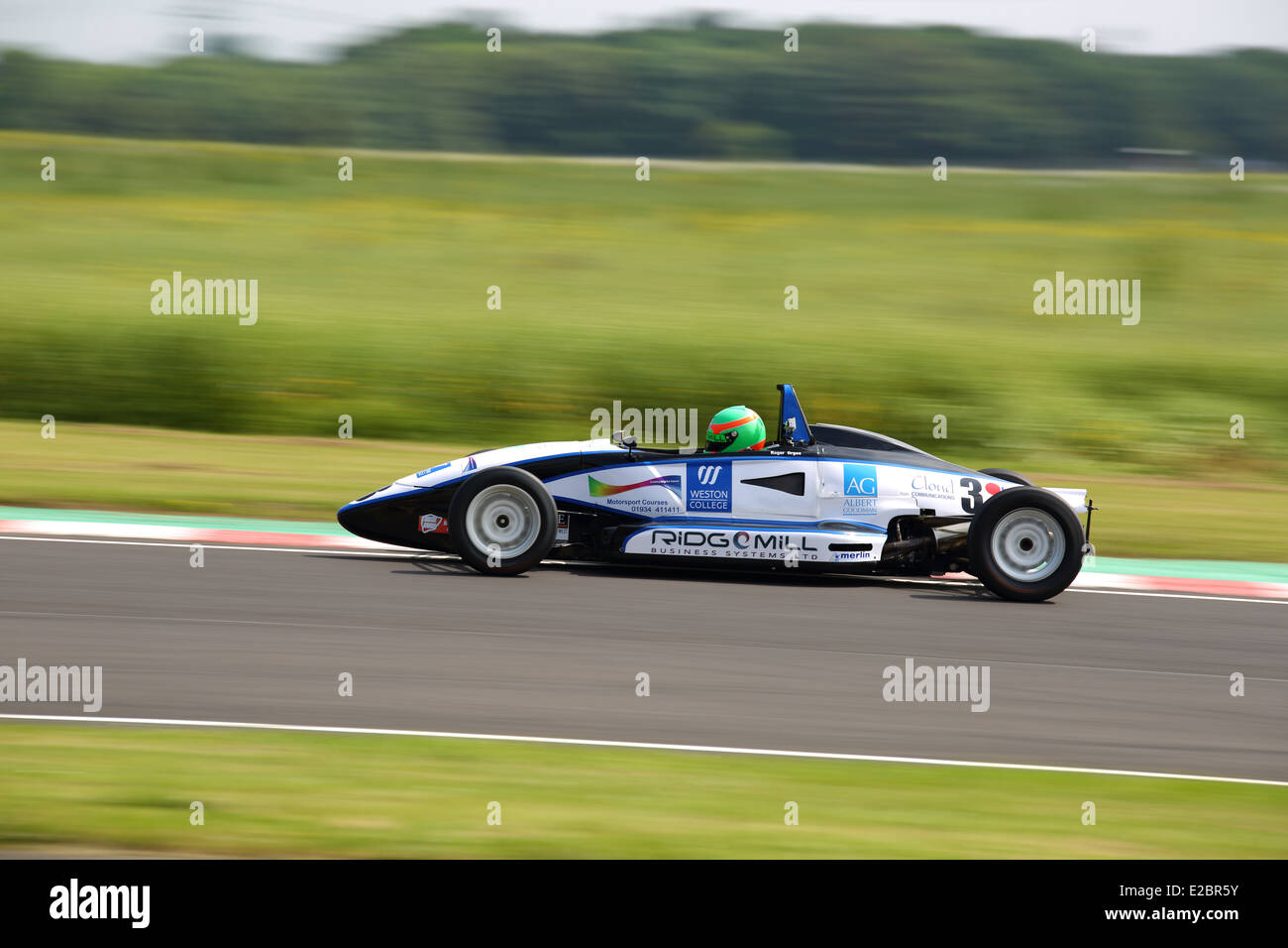 Cars racing at Castle Combe Circuit Stock Photo - Alamy