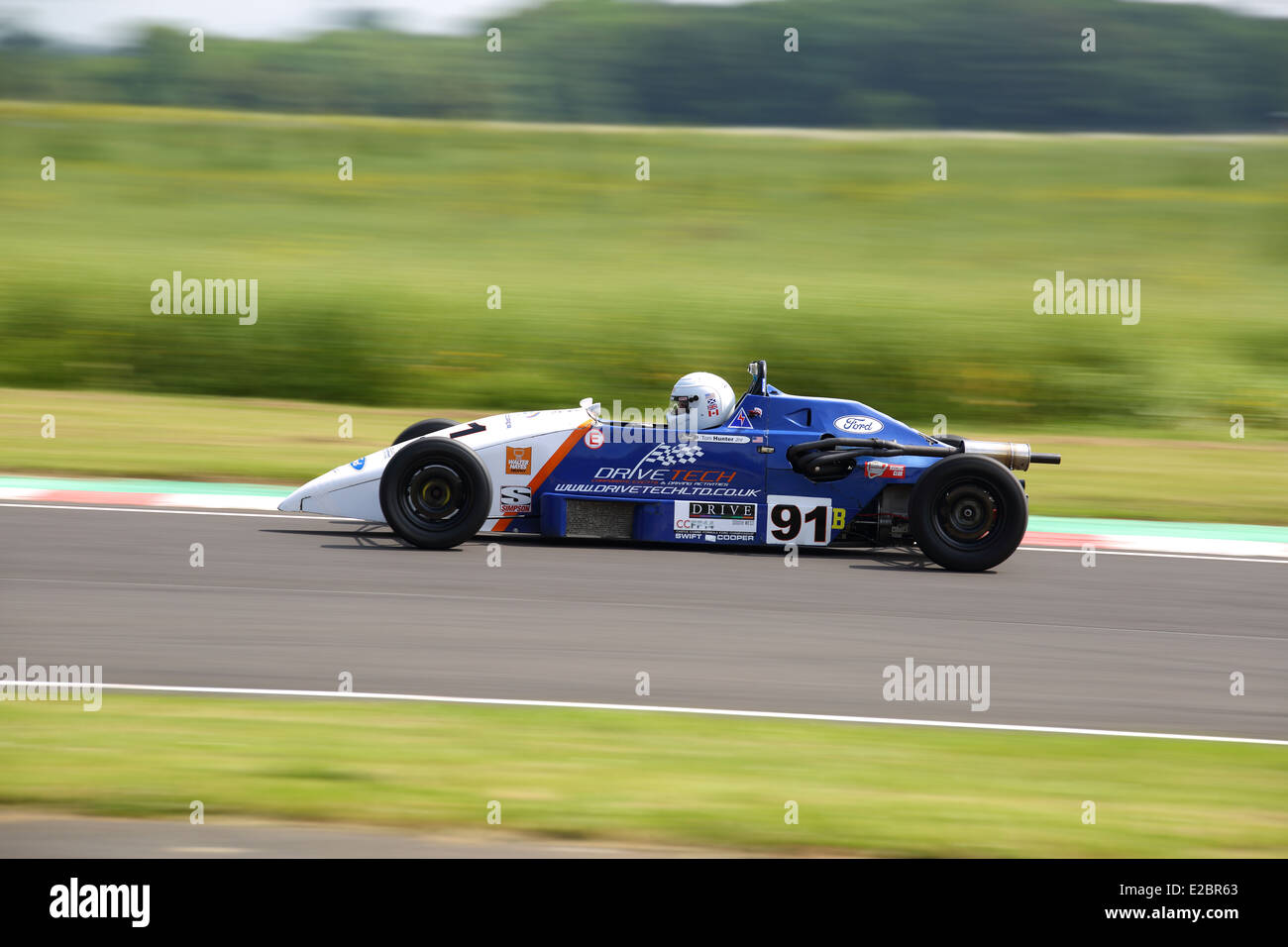 Cars racing at Castle Combe Circuit Stock Photo - Alamy