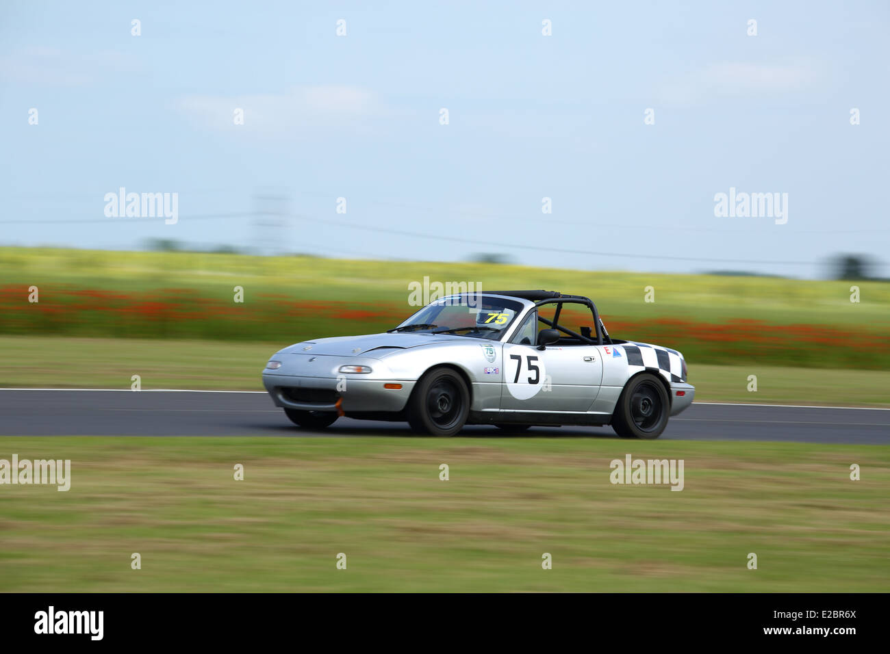 Cars racing at Castle Combe Circuit Stock Photo - Alamy