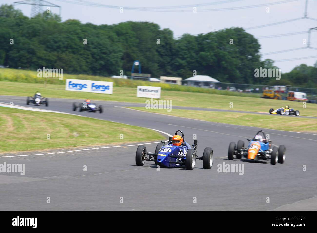 Cars racing at Castle Combe Circuit Stock Photo - Alamy