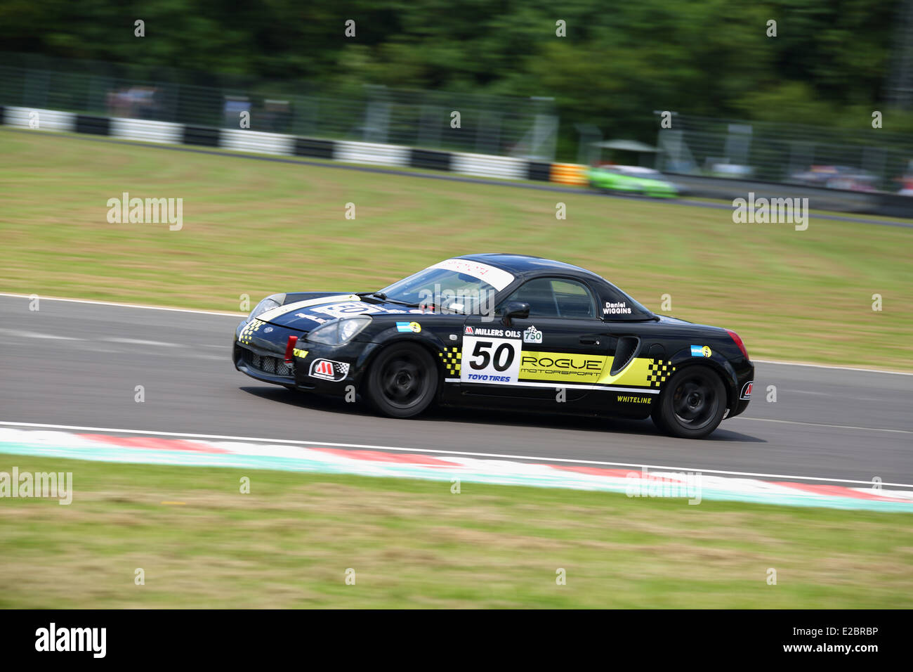 Cars racing at Castle Combe Circuit Stock Photo - Alamy