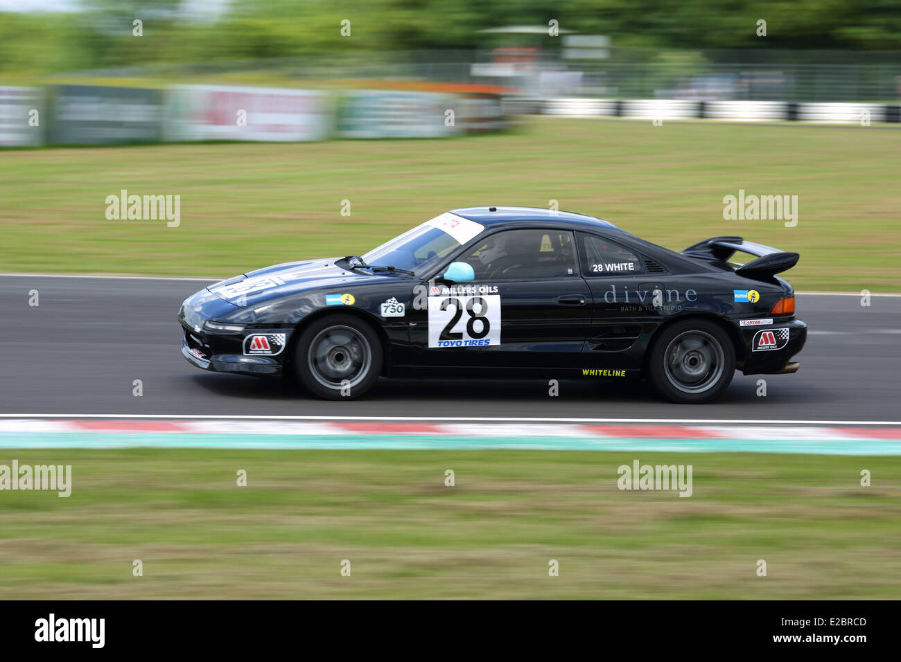 Cars racing at Castle Combe Circuit Stock Photo - Alamy