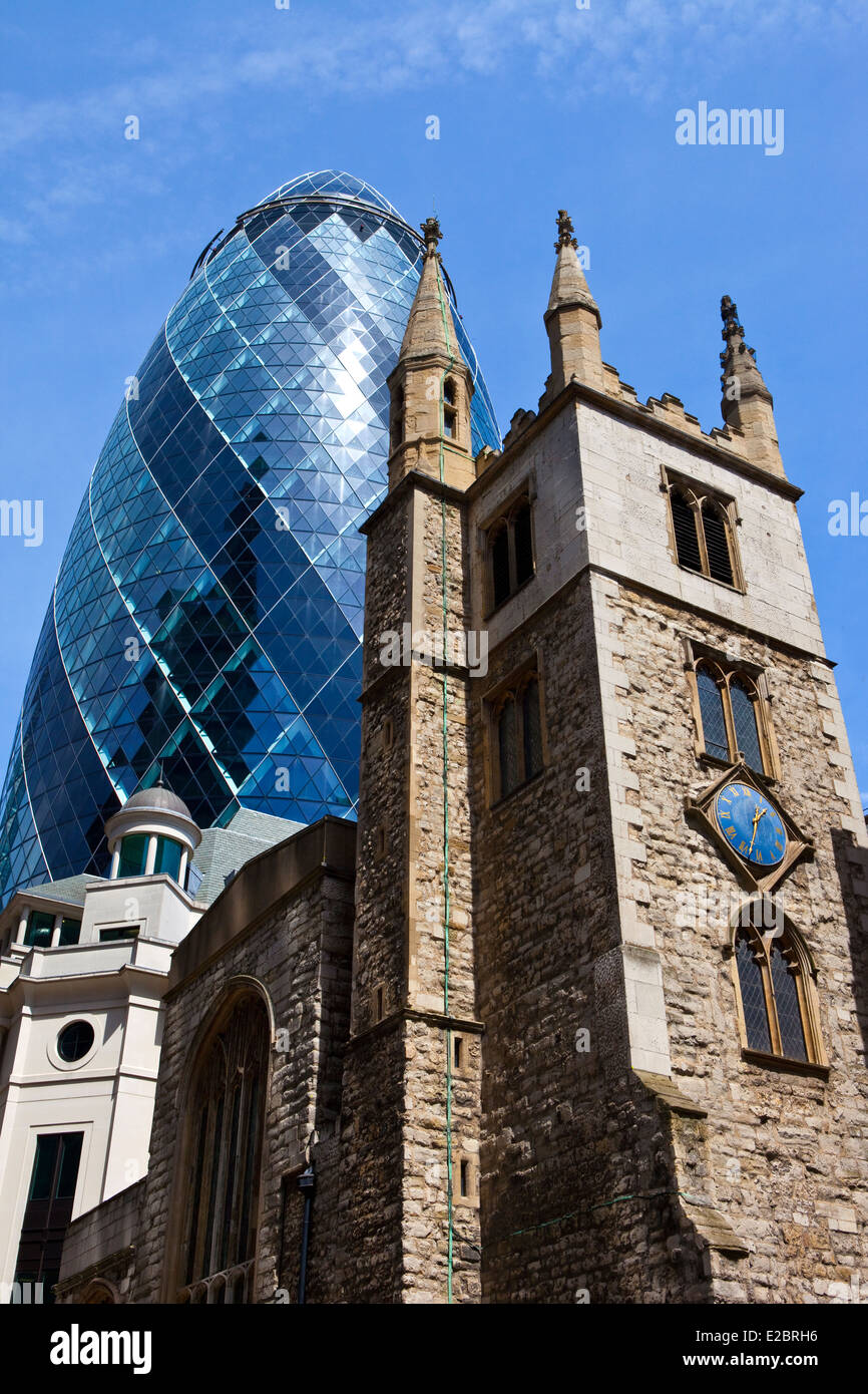 The historic St. Andrew Undershaft Church with 30 St. Mary Axe towering ...