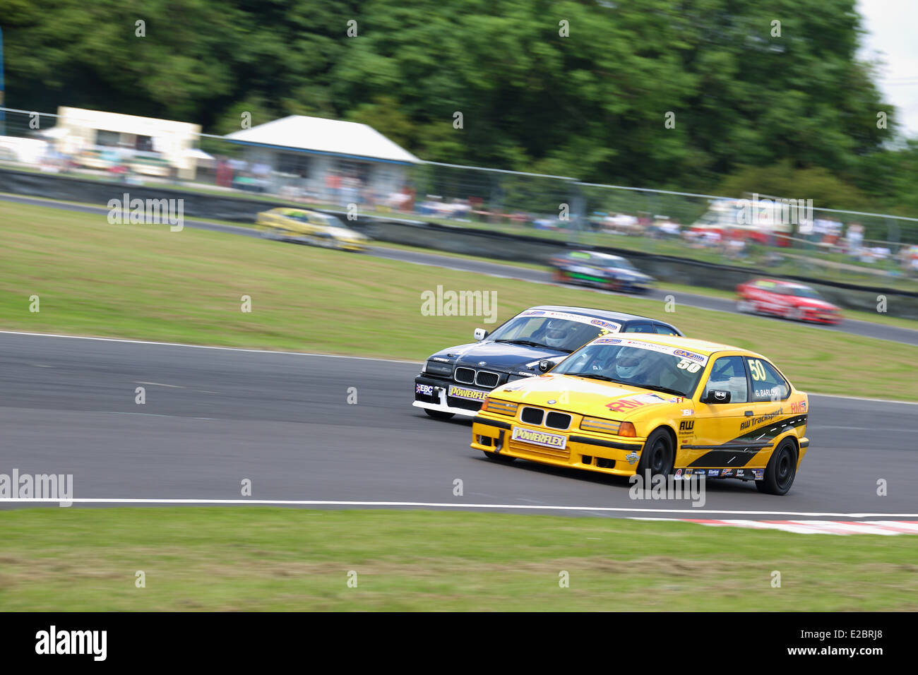 Cars racing at Castle Combe Circuit Stock Photo - Alamy