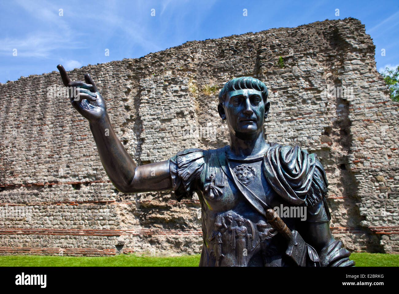 Statue of Roman Emperor Trajan with remains of London Wall which was ...