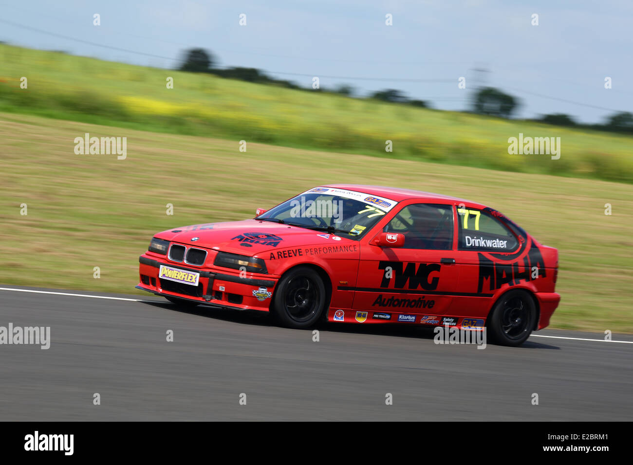 Cars racing at Castle Combe Circuit Stock Photo - Alamy