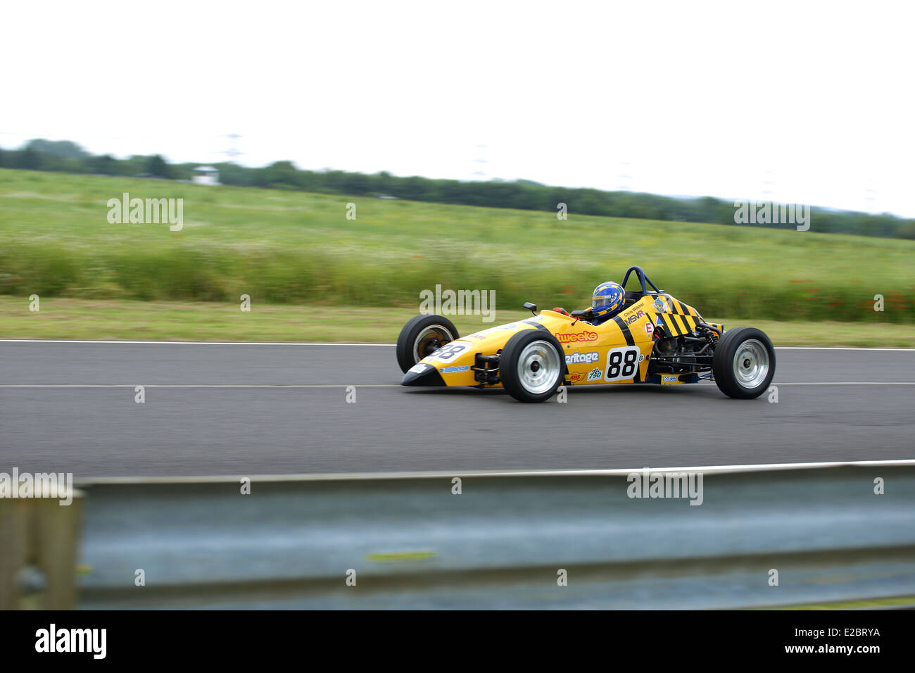 Cars racing at Castle Combe Circuit Stock Photo - Alamy