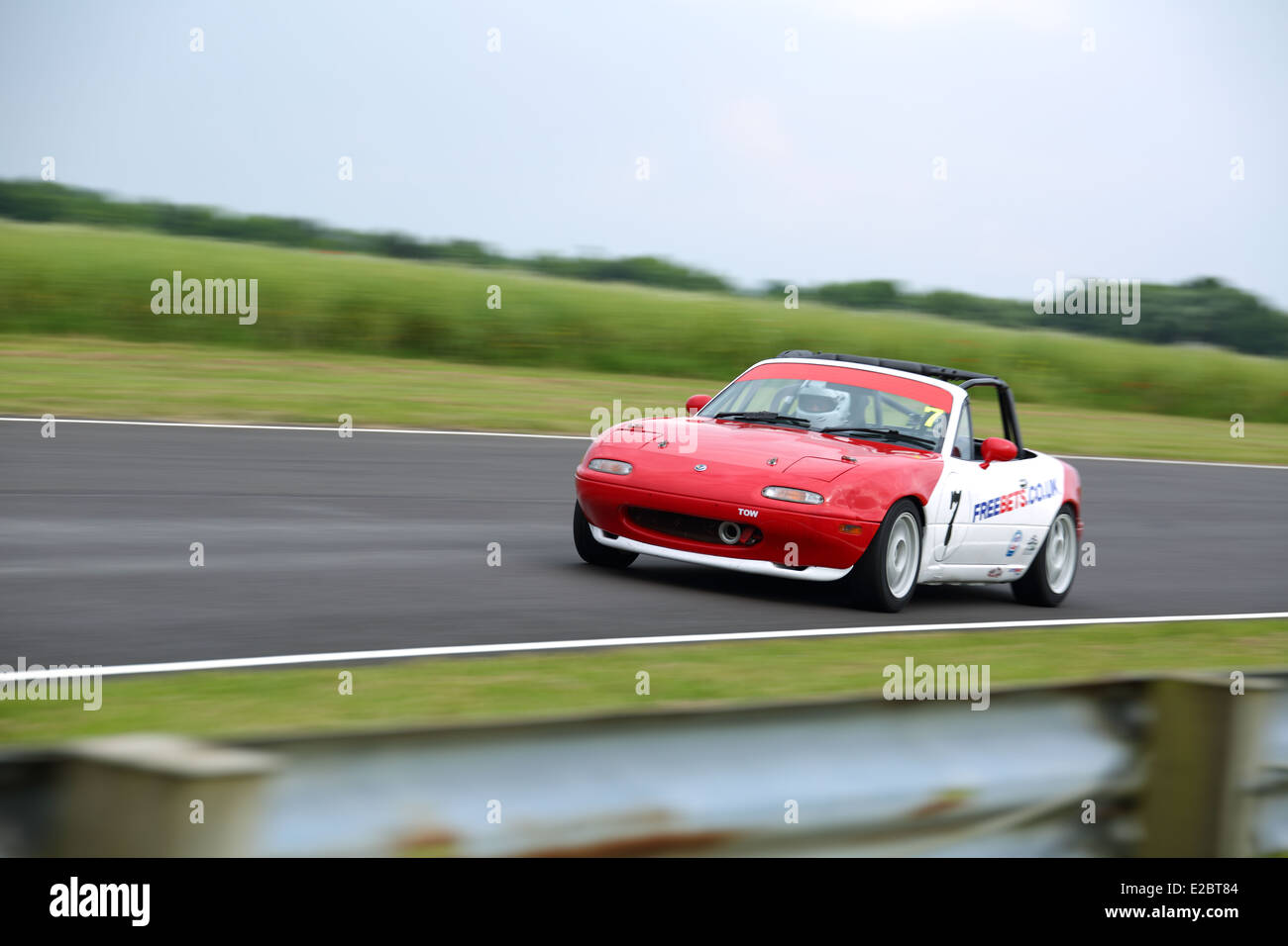 Cars racing at Castle Combe Circuit Stock Photo - Alamy