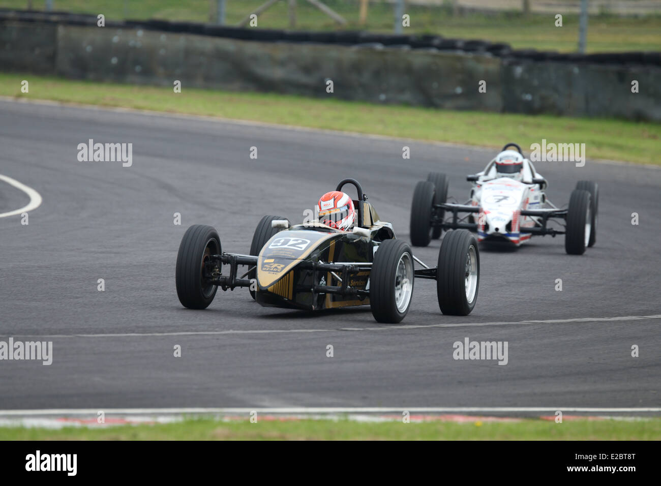 Cars racing at Castle Combe Circuit Stock Photo - Alamy