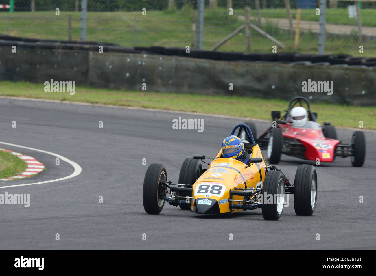 Cars racing at Castle Combe Circuit Stock Photo - Alamy