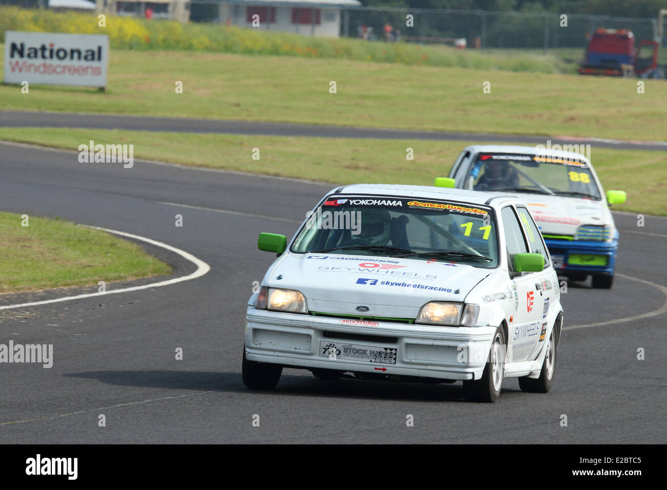 Cars racing at Castle Combe Circuit Stock Photo - Alamy