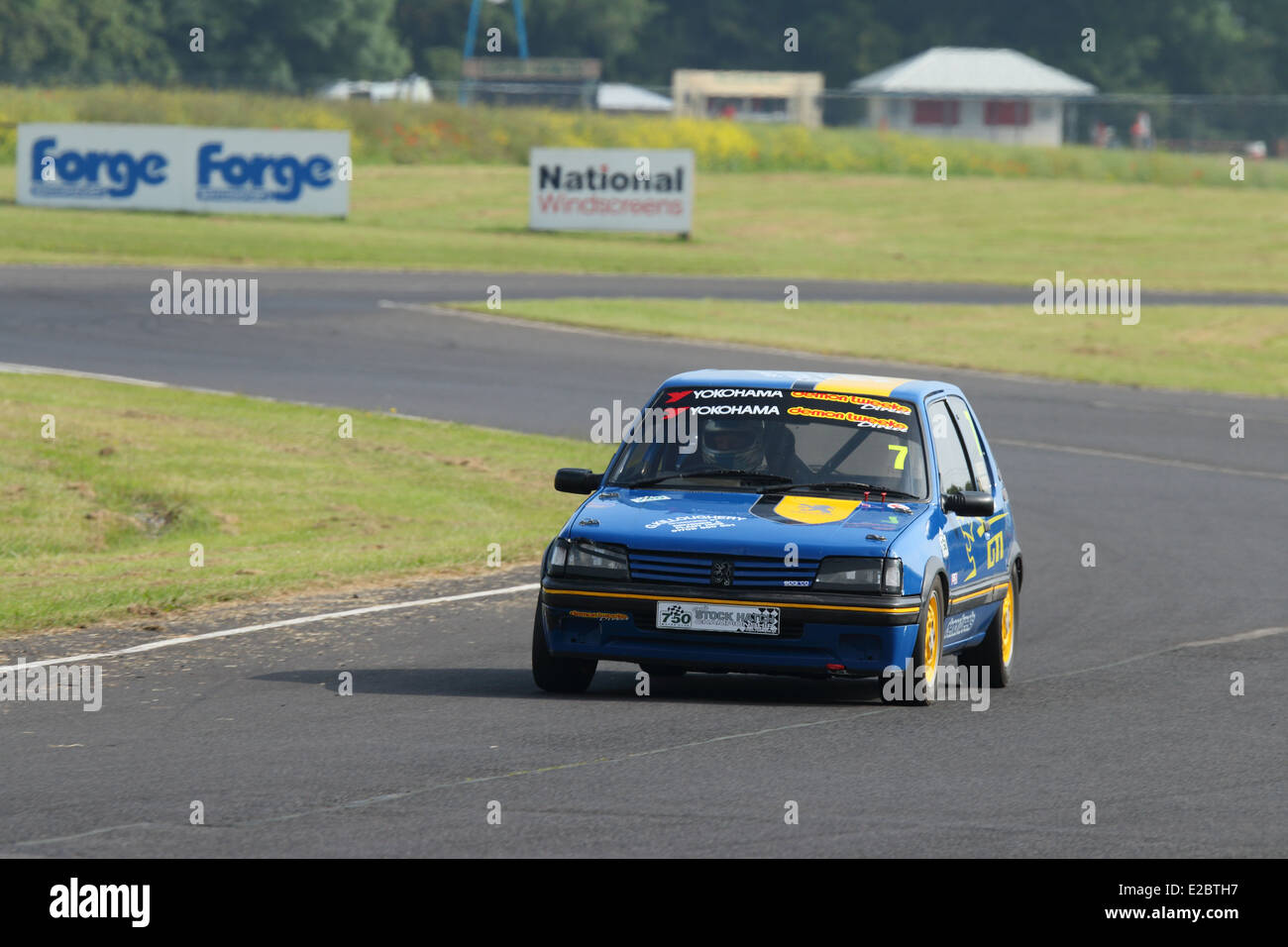 Cars racing at Castle Combe Circuit Stock Photo - Alamy