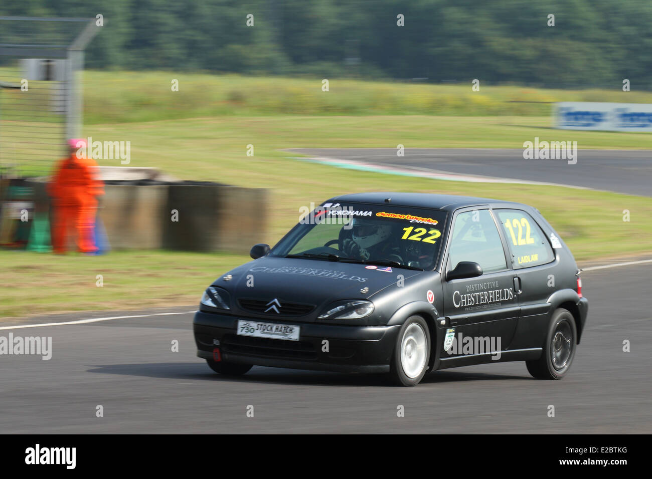Cars racing at Castle Combe Circuit Stock Photo - Alamy