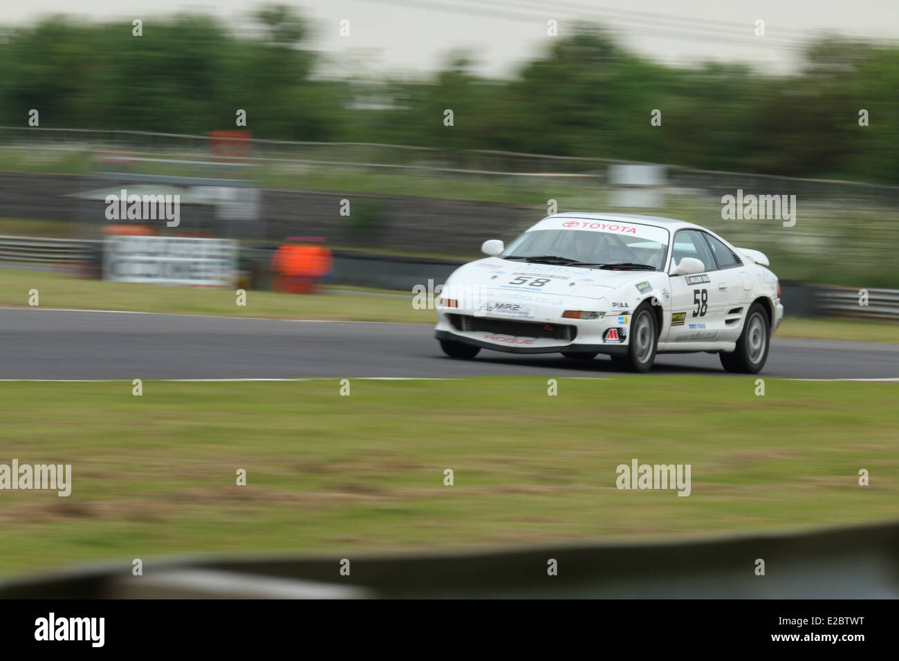 Cars racing at Castle Combe Circuit Stock Photo - Alamy