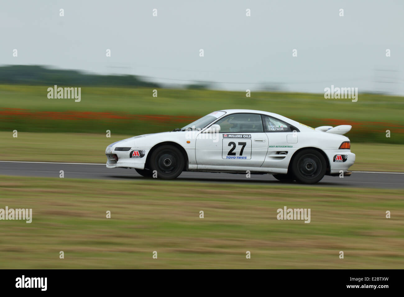 Cars racing at Castle Combe Circuit Stock Photo - Alamy