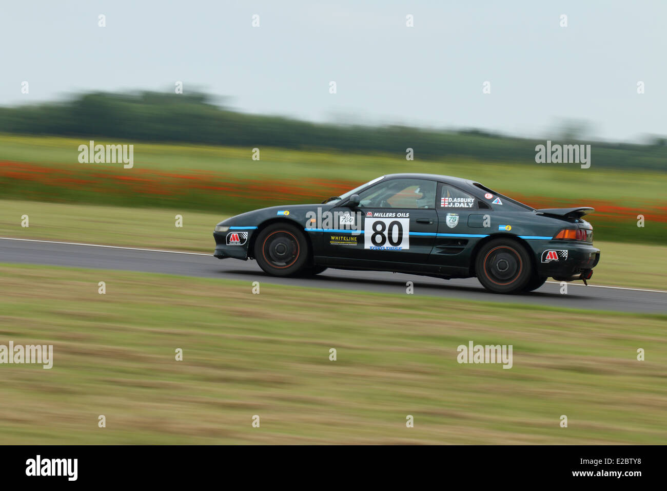 Cars racing at Castle Combe Circuit Stock Photo - Alamy