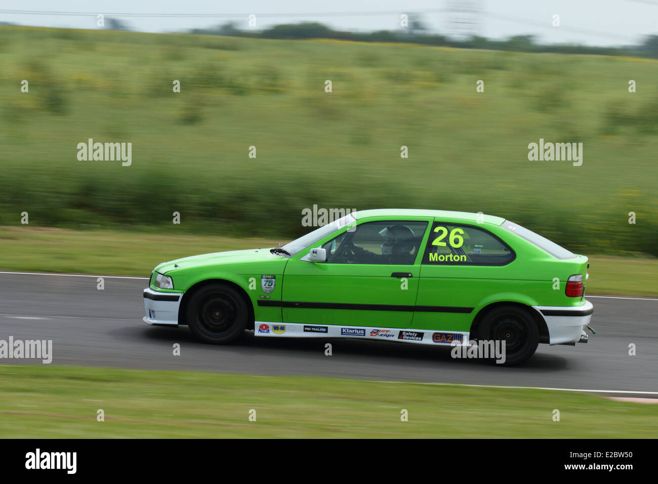 Cars racing at Castle Combe Circuit Stock Photo - Alamy