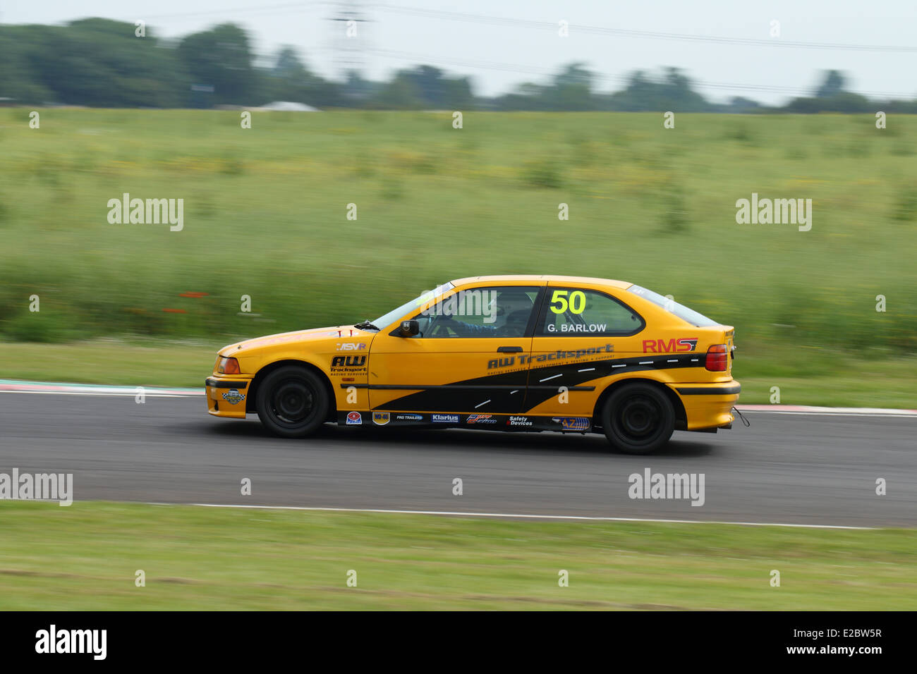 Cars racing at Castle Combe Circuit Stock Photo - Alamy
