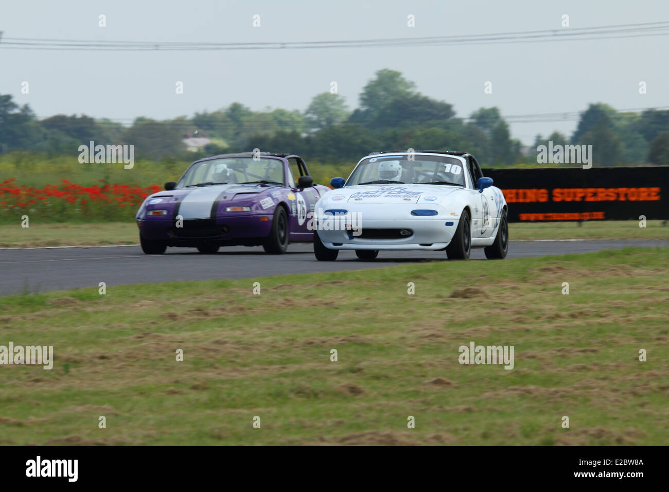Cars racing at Castle Combe Circuit Stock Photo - Alamy