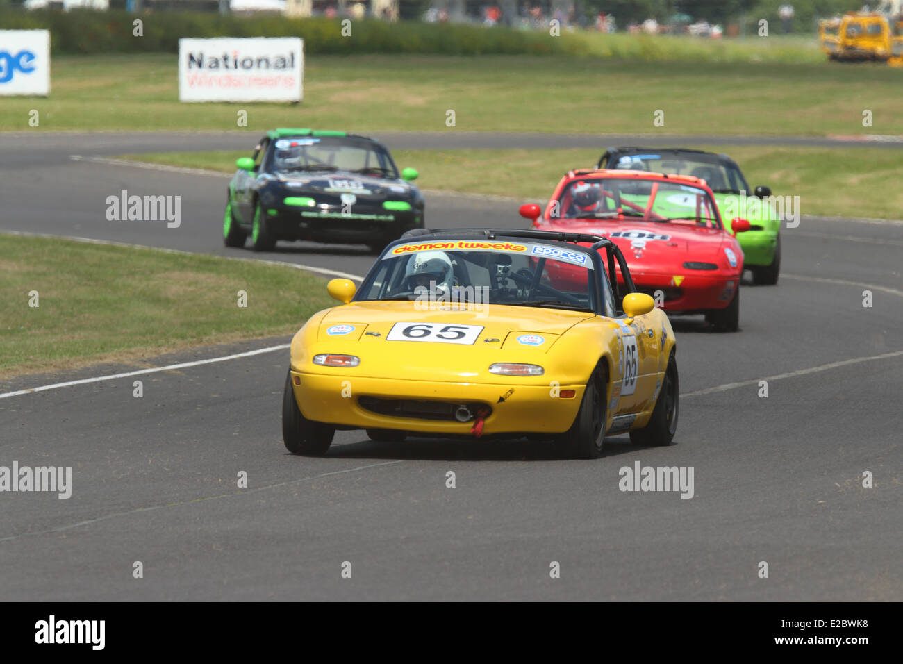 Cars racing at Castle Combe Circuit Stock Photo - Alamy