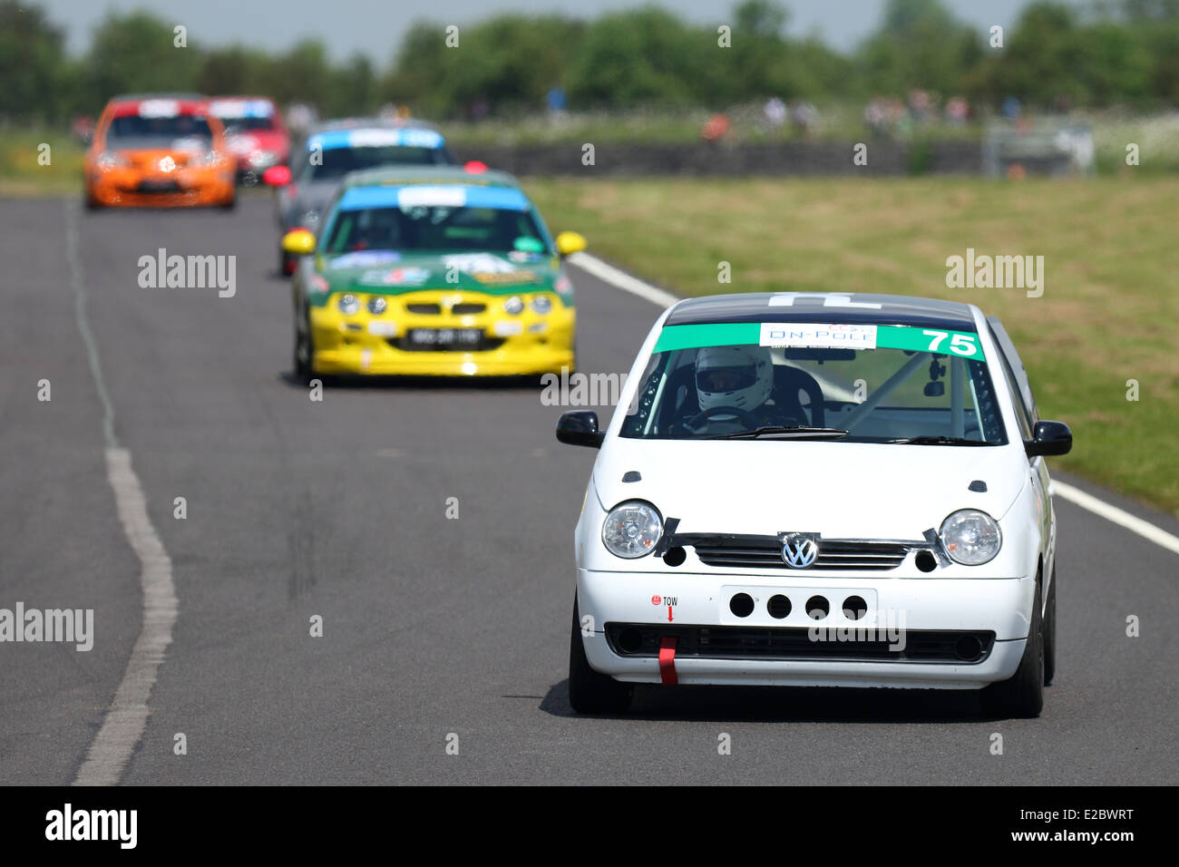 Cars racing at Castle Combe Circuit Stock Photo - Alamy