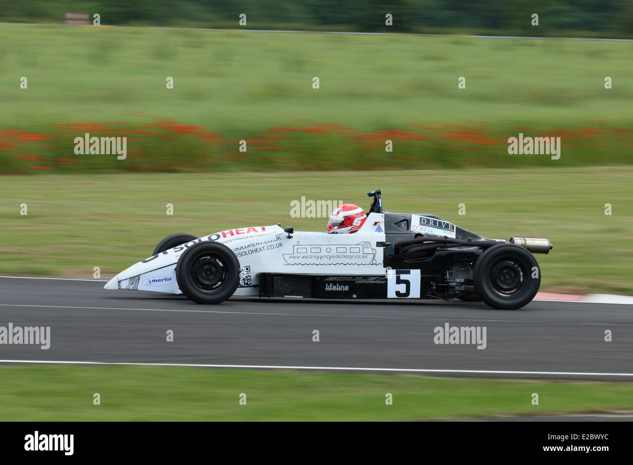 Cars racing at Castle Combe Circuit Stock Photo - Alamy
