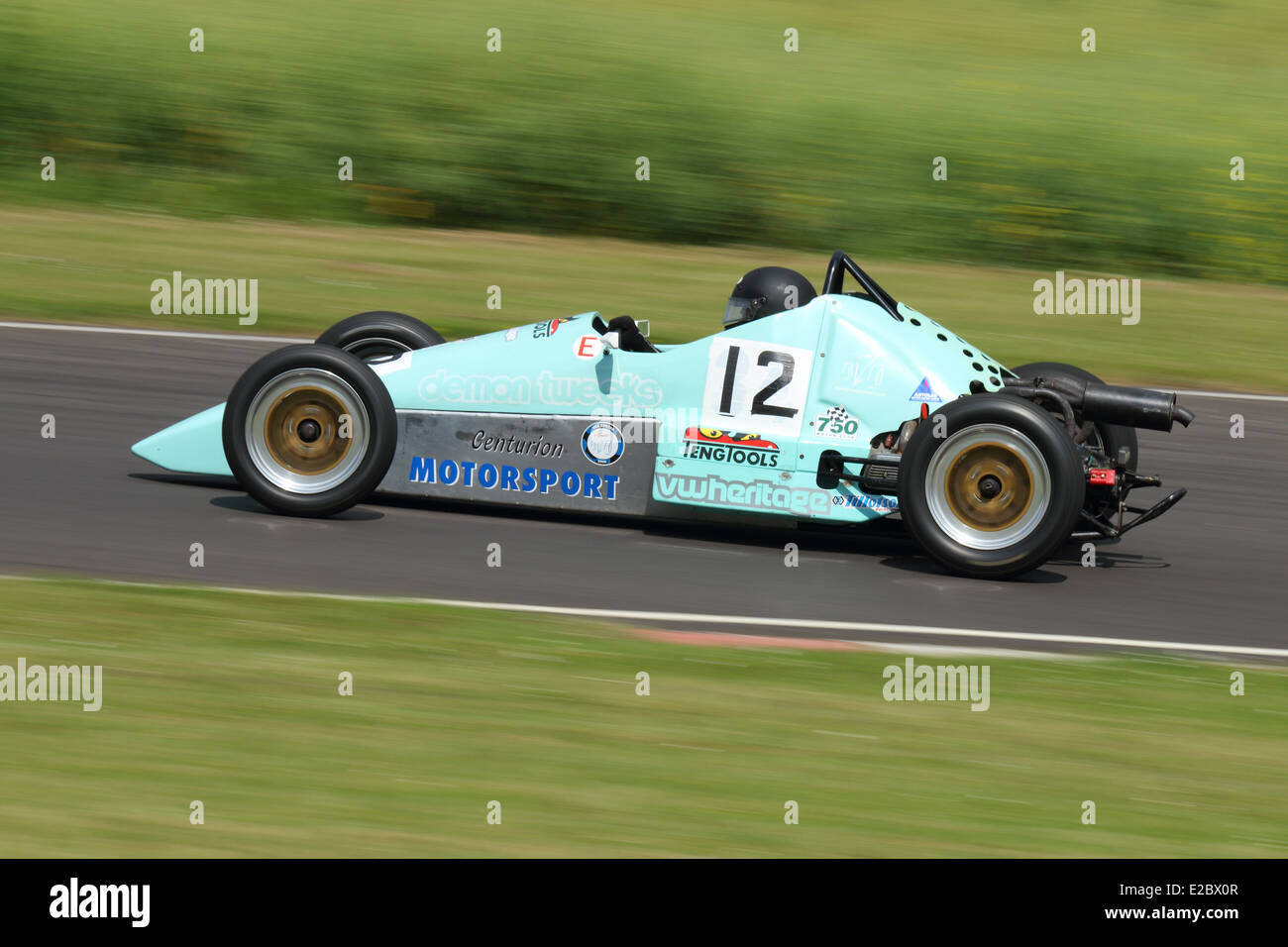 Cars racing at Castle Combe Circuit Stock Photo - Alamy