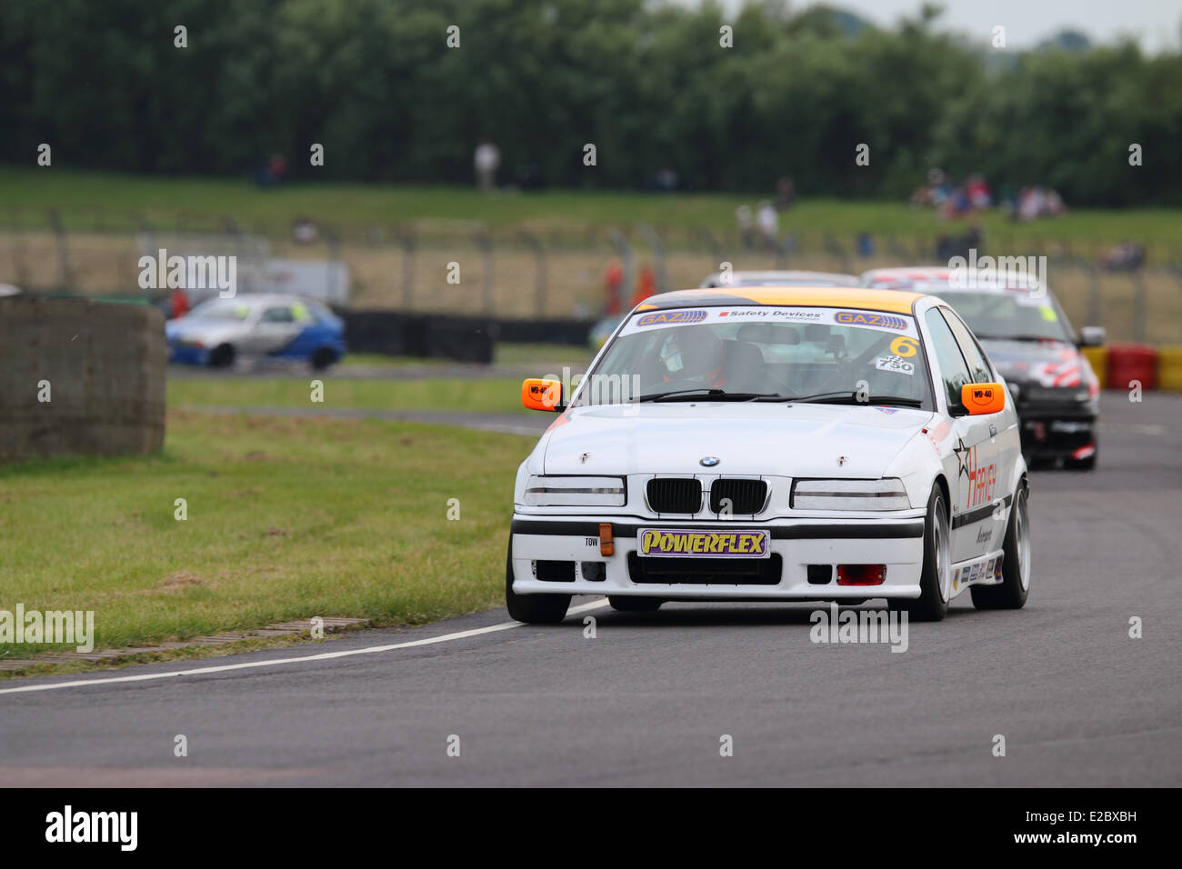 Cars racing at Castle Combe Circuit Stock Photo - Alamy