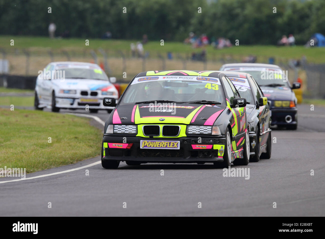 Cars racing at Castle Combe Circuit Stock Photo - Alamy