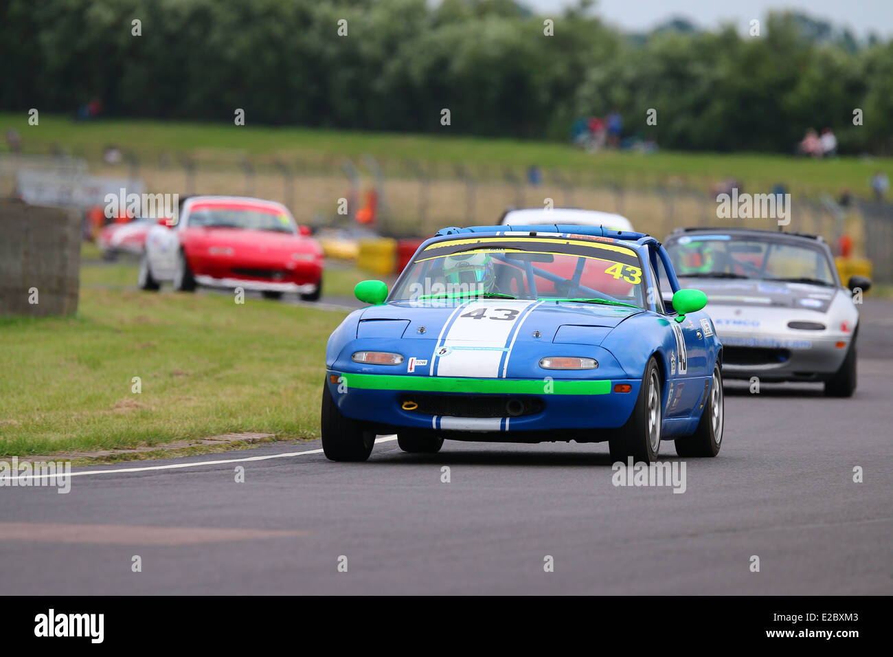 Cars racing at Castle Combe Circuit Stock Photo - Alamy